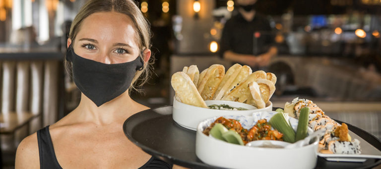 Waitress carrying a tray with food. - County Lines Online